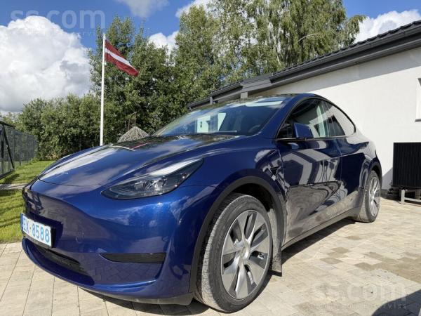 Blue Tesla Model Y 2023 in Riga, with an engine capacity of 0.00 L and mileage of 111 thousand km for 30450 €, photo 1 on AUTOMOTO.COM.LV