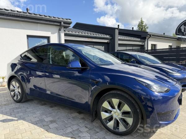 Blue Tesla Model Y 2023 in Riga, with an engine capacity of 0.00 L and mileage of 111 thousand km for 30450 €, photo 2 on AUTOMOTO.COM.LV