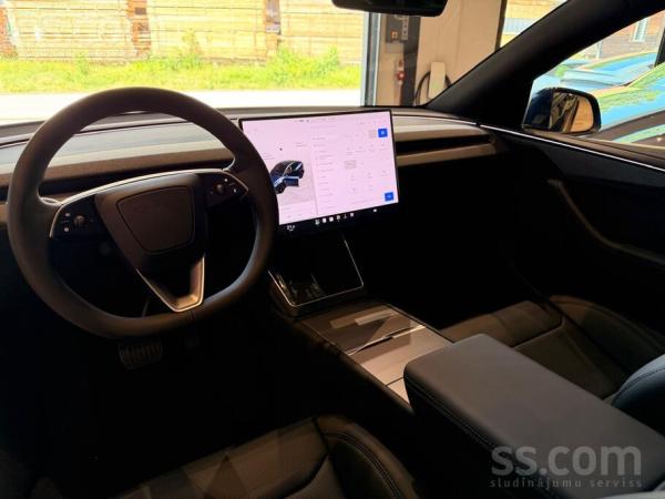 Blue Tesla Model Y 2026 in Riga, with an engine capacity of 0.00 L and mileage of 10 thousand km for 59900 €, photo 7 on AUTOMOTO.COM.LV