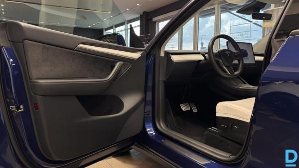 Blue Tesla Model Y 2023 in Marupe, with an engine capacity of 0.00 L and mileage of 60 thousand km for 35990 €, photo 5 on AUTOMOTO.COM.LV