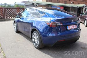 Blue Tesla Model Y 2023 in Liepaja, with an engine capacity of 0.00 L and mileage of 190 thousand km for 26500 €, photo 4 on AUTOMOTO.COM.LV
