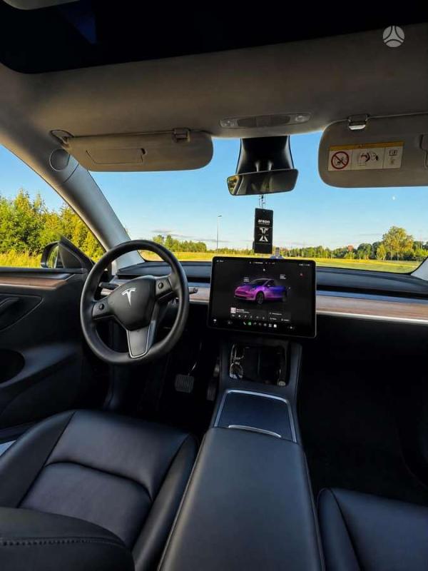 Blue Tesla Model Y 2023 in Vilnius, with an engine capacity of 0.00 L and mileage of 72 thousand km for 25700 €, photo 5 on AUTOMOTO.COM.LV