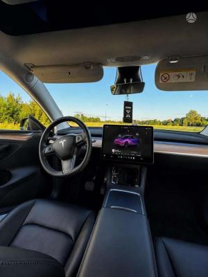 Blue Tesla Model Y 2023 in Vilnius, with an engine capacity of 0.00 L and mileage of 72 thousand km for 25700 €, photo 6 on AUTOMOTO.COM.LV