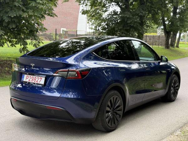 Blue Tesla Model Y 2023 in Marijampole, with an engine capacity of 0.00 L and mileage of 77 thousand km for 28500 €, photo 6 on AUTOMOTO.COM.LV