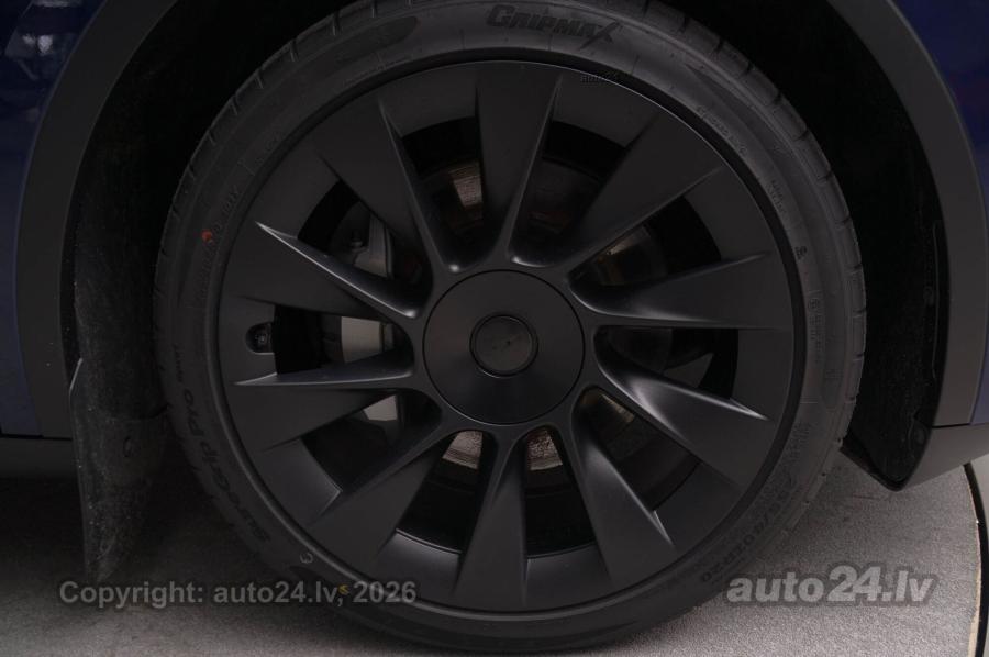 Blue Tesla Model Y 2024 in Tallinn, with an engine capacity of 0.00 L and mileage of 50 thousand km for 42990 €, photo 18 on AUTOMOTO.COM.LV