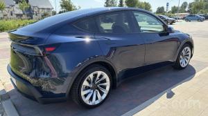Blue Tesla Model Y 2026 in Riga, with an engine capacity of 0.00 L and mileage of 20 thousand km for 57000 €, photo 4 on AUTOMOTO.COM.LV