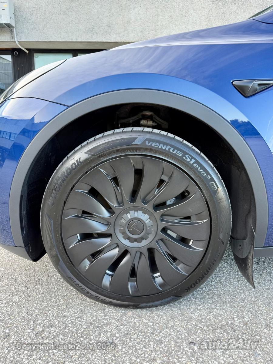 Blue Tesla Model Y 2023 in Tallinn, with an engine capacity of 0.00 L and mileage of 105 thousand km for 33800 €, photo 25 on AUTOMOTO.COM.LV