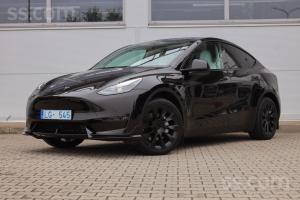 Brown Tesla Model Y 2021 in Riga, with an engine capacity of 0.00 L and mileage of 0 thousand km for 34995 €, photo  on AUTOMOTO.COM.LV