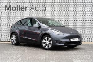 Grey Tesla Model Y 2022 in Riga, with an engine capacity of 0.00 L and mileage of 66 thousand km for 31490 €, photo 2 on AUTOMOTO.COM.LV
