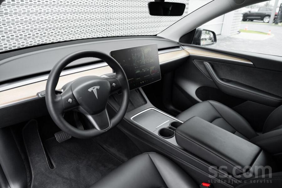 Grey Tesla Model Y 2022 in Riga, with an engine capacity of 0.00 L and mileage of 66 thousand km for 31490 €, photo 9 on AUTOMOTO.COM.LV