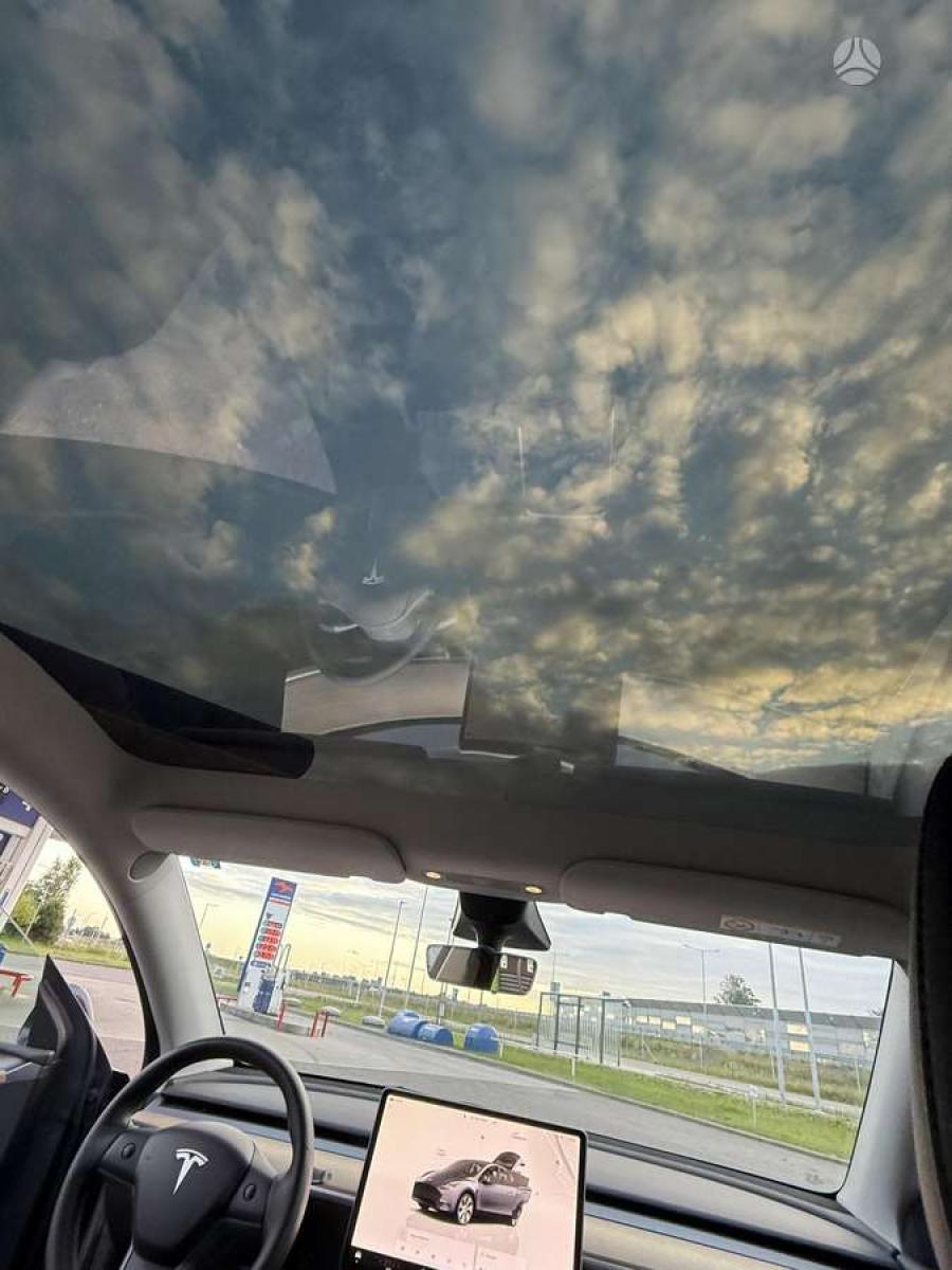 Grey Tesla Model Y 2022 in Marijampole, with an engine capacity of 0.00 L and mileage of 135 thousand km for 27900 €, photo 17 on AUTOMOTO.COM.LV
