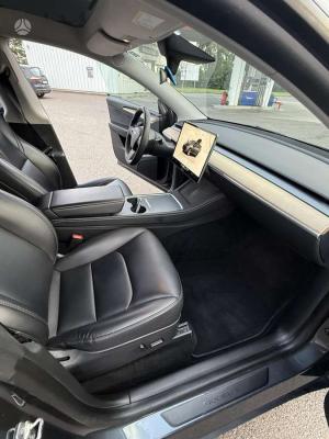 Grey Tesla Model Y 2022 in Marijampole, with an engine capacity of 0.00 L and mileage of 135 thousand km for 27900 €, photo 19 on AUTOMOTO.COM.LV