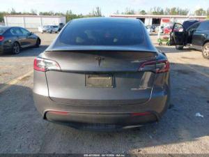 Grey Tesla Model Y 2023 in Klaipeda, with an engine capacity of 0.00 L and mileage of 53 thousand km for 12100 €, photo 17 on AUTOMOTO.COM.LV