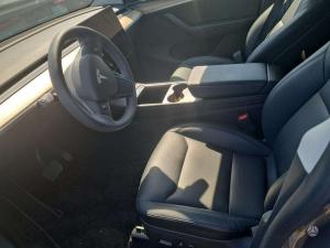Grey Tesla Model Y 2023 in Klaipeda, with an engine capacity of 0.00 L and mileage of 56 thousand km for 21900 €, photo 6 on AUTOMOTO.COM.LV