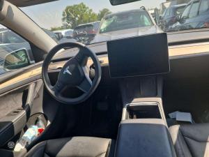 Grey Tesla Model Y 2023 in Klaipeda, with an engine capacity of 0.00 L and mileage of 56 thousand km for 21900 €, photo 7 on AUTOMOTO.COM.LV
