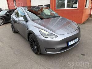 Grey Tesla Model Y 2024 in Riga, with an engine capacity of 0.00 L and mileage of 68 thousand km for 39600 €, photo 3 on AUTOMOTO.COM.LV