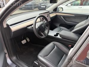 Grey Tesla Model Y 2024 in Riga, with an engine capacity of 0.00 L and mileage of 68 thousand km for 39600 €, photo 6 on AUTOMOTO.COM.LV