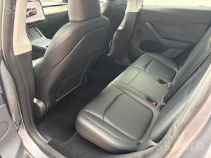 Grey Tesla Model Y 2024 in Riga, with an engine capacity of 0.00 L and mileage of 68 thousand km for 39600 €, photo 7 on AUTOMOTO.COM.LV
