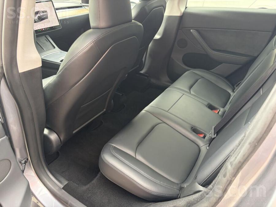 Grey Tesla Model Y 2024 in Riga, with an engine capacity of 0.00 L and mileage of 68 thousand km for 39600 €, photo 7 on AUTOMOTO.COM.LV