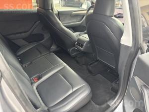 Grey Tesla Model Y 2024 in Riga, with an engine capacity of 0.00 L and mileage of 68 thousand km for 39600 €, photo 9 on AUTOMOTO.COM.LV