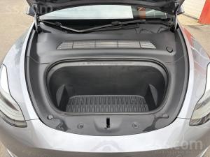 Grey Tesla Model Y 2024 in Riga, with an engine capacity of 0.00 L and mileage of 68 thousand km for 39600 €, photo 10 on AUTOMOTO.COM.LV