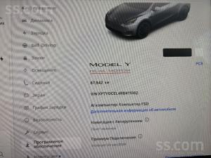 Grey Tesla Model Y 2024 in Riga, with an engine capacity of 0.00 L and mileage of 68 thousand km for 39600 €, photo 12 on AUTOMOTO.COM.LV