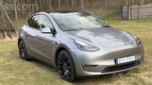 Grey Tesla Model Y 2025 in Riga, with an engine capacity of 0.00 L and mileage of 18 thousand km for 49500 €, photo 4 on AUTOMOTO.COM.LV
