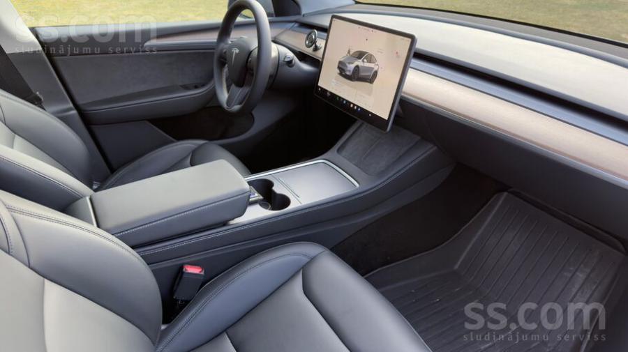 Grey Tesla Model Y 2025 in Riga, with an engine capacity of 0.00 L and mileage of 18 thousand km for 49500 €, photo 15 on AUTOMOTO.COM.LV