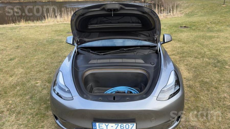 Grey Tesla Model Y 2025 in Riga, with an engine capacity of 0.00 L and mileage of 18 thousand km for 49500 €, photo 30 on AUTOMOTO.COM.LV