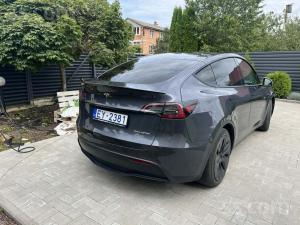 Grey Tesla Model Y 2022 in Riga, with an engine capacity of 0.00 L and mileage of 95 thousand km for 29500 €, photo  on AUTOMOTO.COM.LV