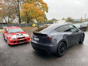 Grey Tesla Model Y 2022 in Riga, with an engine capacity of 0.00 L and mileage of 141 thousand km for 28500 €, photo  on AUTOMOTO.COM.LV