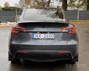 Grey Tesla Model Y 2022 in Riga, with an engine capacity of 0.00 L and mileage of 141 thousand km for 28500 €, photo 6 on AUTOMOTO.COM.LV