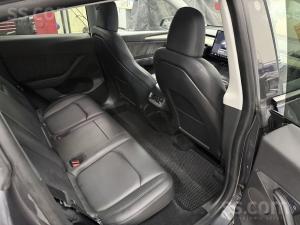 Grey Tesla Model Y 2022 in Riga, with an engine capacity of 0.00 L and mileage of 141 thousand km for 28500 €, photo 14 on AUTOMOTO.COM.LV