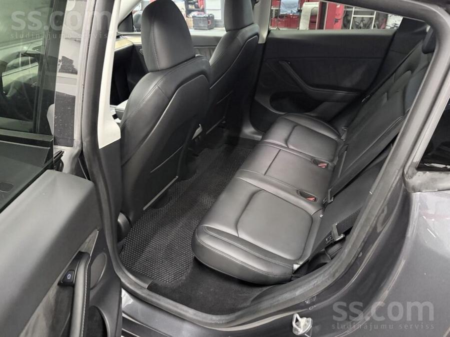 Grey Tesla Model Y 2022 in Riga, with an engine capacity of 0.00 L and mileage of 141 thousand km for 28500 €, photo 15 on AUTOMOTO.COM.LV