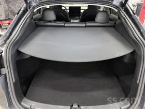 Grey Tesla Model Y 2022 in Riga, with an engine capacity of 0.00 L and mileage of 141 thousand km for 28500 €, photo 17 on AUTOMOTO.COM.LV
