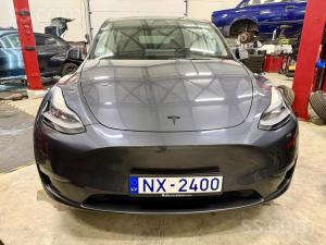 Grey Tesla Model Y 2022 in Riga, with an engine capacity of 0.00 L and mileage of 141 thousand km for 28500 €, photo 27 on AUTOMOTO.COM.LV