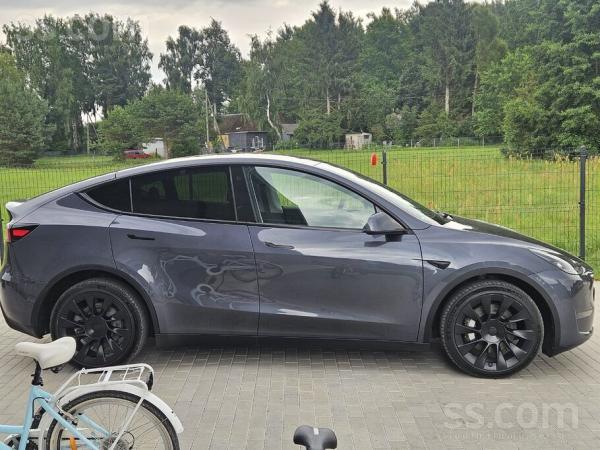 Pelēks Tesla Model Y 2022 Jūrmala, ar dzinēja tilpumu 0.00 L un nobraukumu 95 tūkst. km par 31000 €, foto 4 vietnē AUTOMOTO.COM.LV
