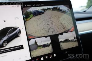 Grey Tesla Model Y 2022 in Tukums, with an engine capacity of 0.00 L and mileage of 77 thousand km for 33000 €, photo 11 on AUTOMOTO.COM.LV