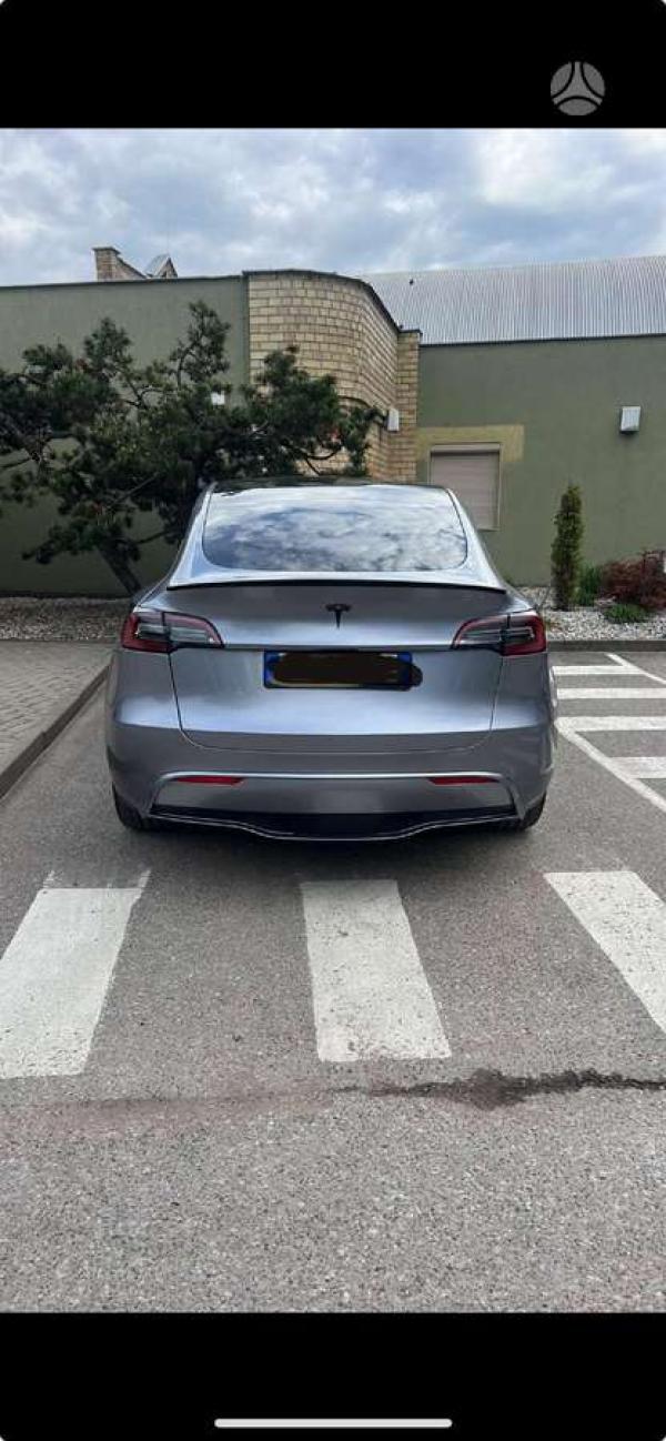 Grey Tesla Model Y 2023 in Kaunas, with an engine capacity of 0.00 L and mileage of 50 thousand km for 33500 €, photo 2 on AUTOMOTO.COM.LV