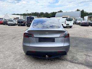 Grey Tesla Model Y 2023 in Radviliskis, with an engine capacity of 0.00 L and mileage of 27 thousand km for 19650 €, photo 7 on AUTOMOTO.COM.LV