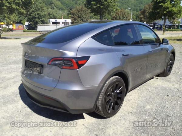 Grey Tesla Model Y 2023 in Tallinn, with an engine capacity of 0.00 L and mileage of 64 thousand km for 39990 €, photo 2 on AUTOMOTO.COM.LV