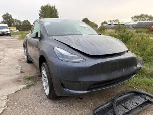 Grey Tesla Model Y 2023 in Kaunas, with an engine capacity of 0.00 L and mileage of 43 thousand km for 15700 €, photo  on AUTOMOTO.COM.LV