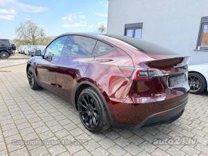 Red Tesla Model Y 2023 in Tartu, with an engine capacity of 0.00 L and mileage of 55 thousand km for 39999 €, photo 5 on AUTOMOTO.COM.LV