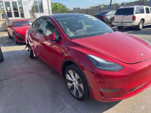 Red Tesla Model Y 2023 in Kaunas, with an engine capacity of 0.00 L and mileage of 26 thousand km for 22450 €, photo 12 on AUTOMOTO.COM.LV