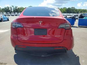 Red Tesla Model Y 2023 in Kaunas, with an engine capacity of 0.00 L and mileage of 26 thousand km for 22450 €, photo 19 on AUTOMOTO.COM.LV