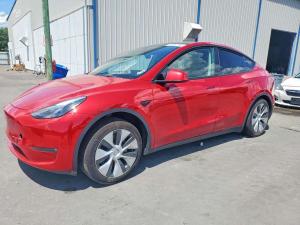 Red Tesla Model Y 2023 in Kaunas, with an engine capacity of 0.00 L and mileage of 26 thousand km for 22450 €, photo 24 on AUTOMOTO.COM.LV