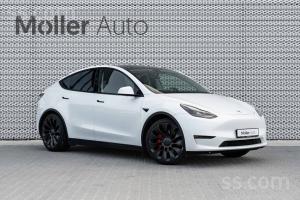 White Tesla Model Y 2022 in Riga, with an engine capacity of 0.00 L and mileage of 24 thousand km for 32499 €, photo 2 on AUTOMOTO.COM.LV