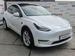 White Tesla Model Y 2022 in Vilnius, with an engine capacity of 0.00 L and mileage of 33 thousand km for 34900 €, photo 3 on AUTOMOTO.COM.LV