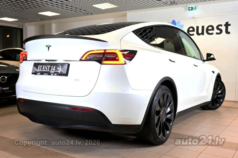 White Tesla Model Y 2022 in Tallinn, with an engine capacity of 0.00 L and mileage of 81 thousand km for 38990 €, photo 4 on AUTOMOTO.COM.LV