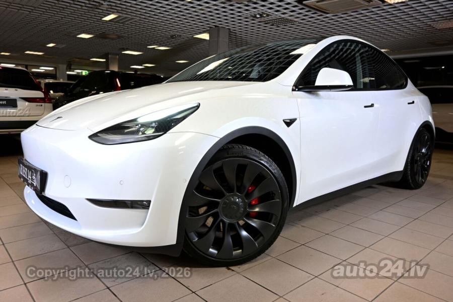 White Tesla Model Y 2022 in Tallinn, with an engine capacity of 0.00 L and mileage of 81 thousand km for 38990 €, photo 5 on AUTOMOTO.COM.LV